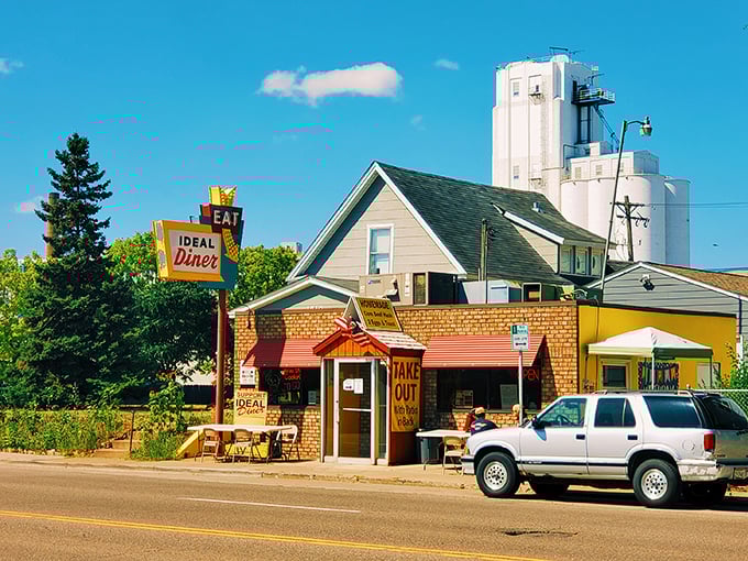 The iconic Ideal Diner sign stands proudly against the Minnesota sky, promising breakfast salvation to hungry Northeast Minneapolis residents since long before brunch became trendy.