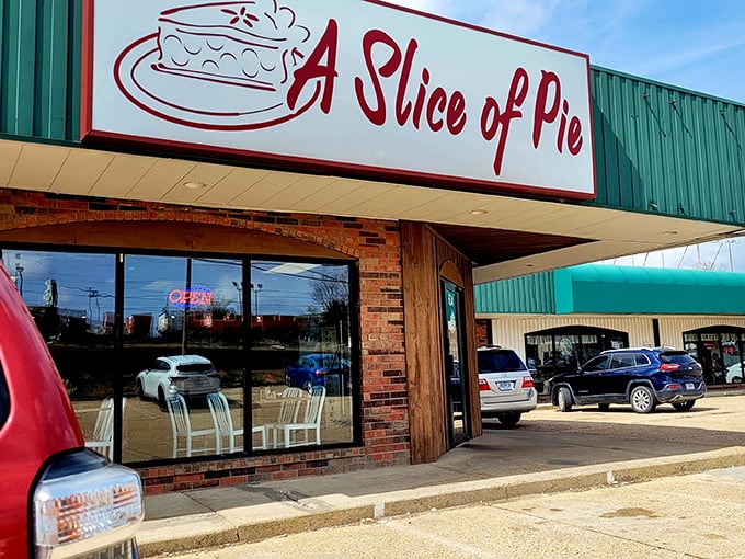 The humble exterior of A Slice of Pie glows like a beacon in the night, promising sweet salvation for dessert lovers passing through Rolla.