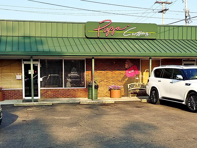 The unassuming green-roofed exterior of Pizza Crossing might not stop traffic, but locals know this brick facade hides flavor treasures worth discovering.