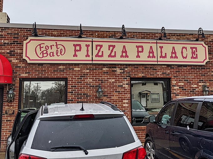 The familiar red awning of Fort Ball Pizza Palace shines like a promise to Tiffin’s hungry crowds—no gimmicks, just unforgettable pizza.