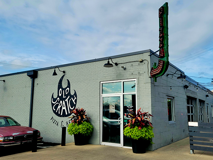 The unassuming exterior of Old Scratch Pizza belies the culinary magic happening inside. That flame logo isn't just for show—it's a promise of fire-kissed perfection.