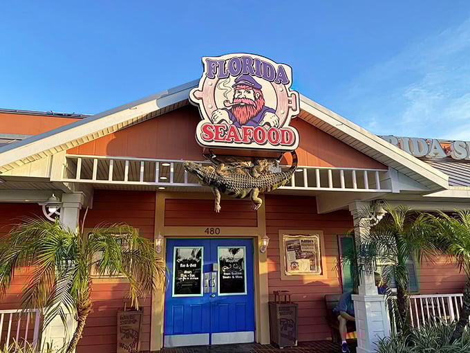 That iconic alligator sculpture isn't just decoration – it's a promise of the authentic Florida experience waiting behind those blue doors.