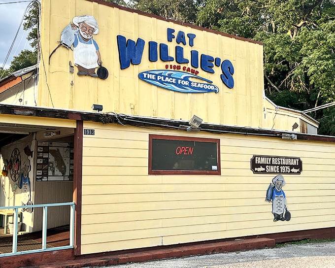 The sunshine-yellow exterior of Fat Willie's Fish Camp stands as a beacon of seafood salvation in Valrico, promising authentic Florida flavors behind its unassuming facade.