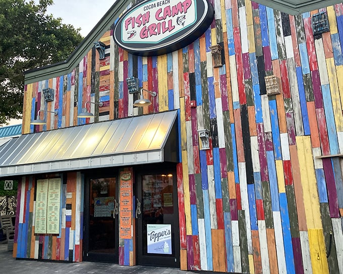 The rainbow explosion of reclaimed wood siding isn't just eye-catching—it's practically shouting "good times ahead!" at everyone driving by.
