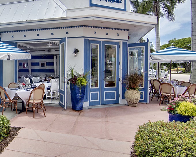 The blue and white façade of Bleu Provence isn't just Instagram-worthy—it's your first clue that culinary magic awaits inside this Naples gem.