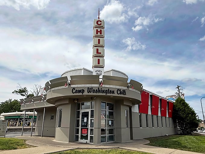 The iconic Camp Washington Chili building stands like a retro beacon of comfort food, its vertical "CHILI" sign promising delicious salvation to hungry travelers.
