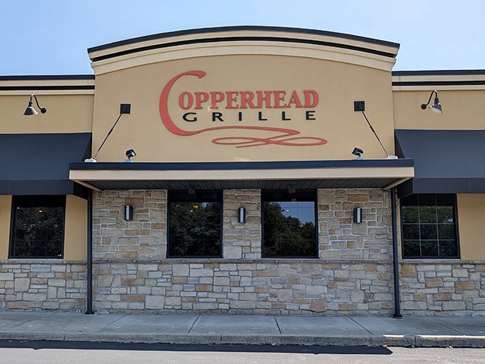 The unassuming exterior of Copperhead Grille hides culinary treasures within, like finding a secret food paradise behind stone and stucco.