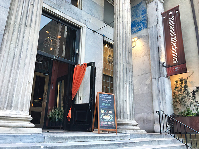 Banking on good taste! National Mechanics' grand columns and historic façade hint at its past life as a 19th-century financial institution before becoming a culinary landmark.