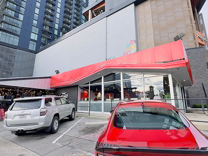 That iconic red awning isn't just a design choice—it's Nashville's equivalent of a lighthouse, guiding hungry souls to hot chicken paradise.