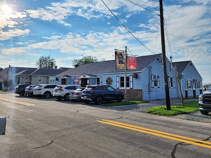The blue exterior with those giant red crab signs isn't just decoration—it's nature's way of saying "seafood paradise ahead!"