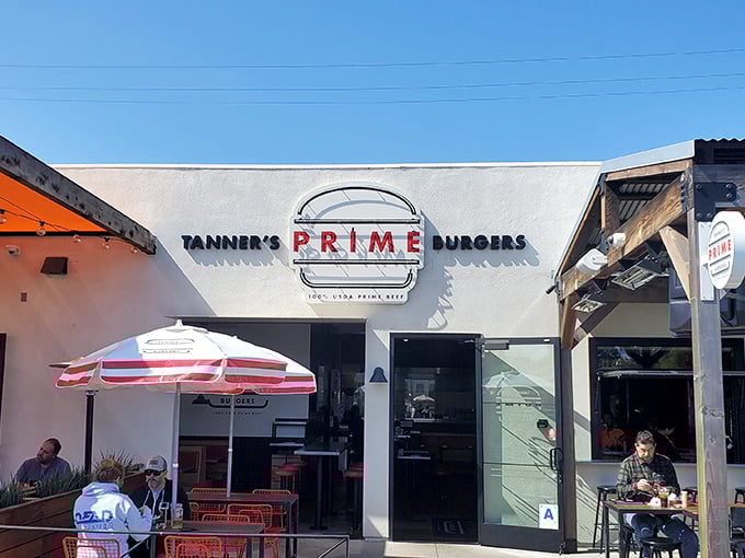 The white facade with that bold red "PRIME" sign isn't just a restaurant entrance—it's a portal to burger nirvana in sunny Oceanside.