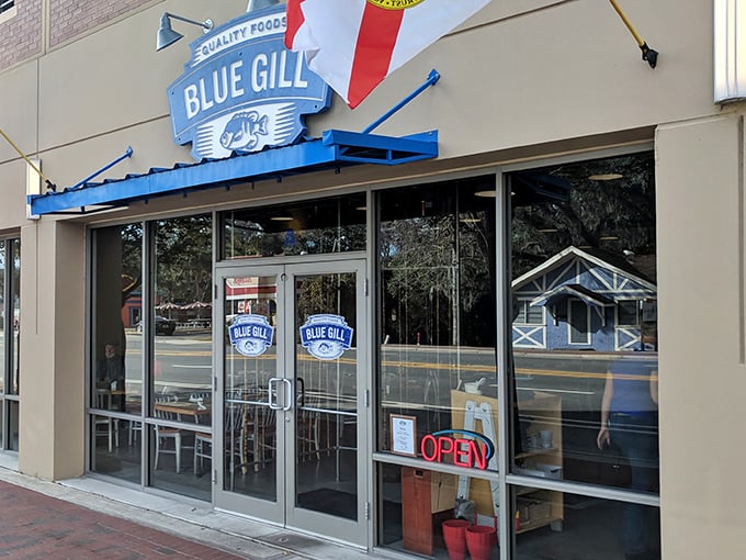 The unassuming storefront of Blue Gill Quality Foods, where culinary magic happens behind a modest façade. Like finding a Picasso at a yard sale.