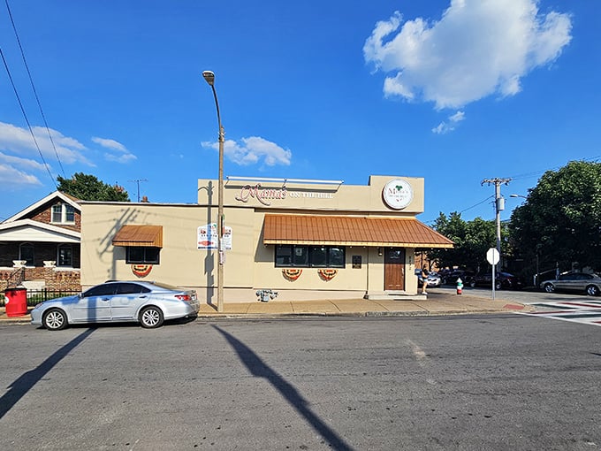 Mama's On The Hill stands proudly under blue Missouri skies, its tan exterior and copper awnings promising Italian-American magic within.