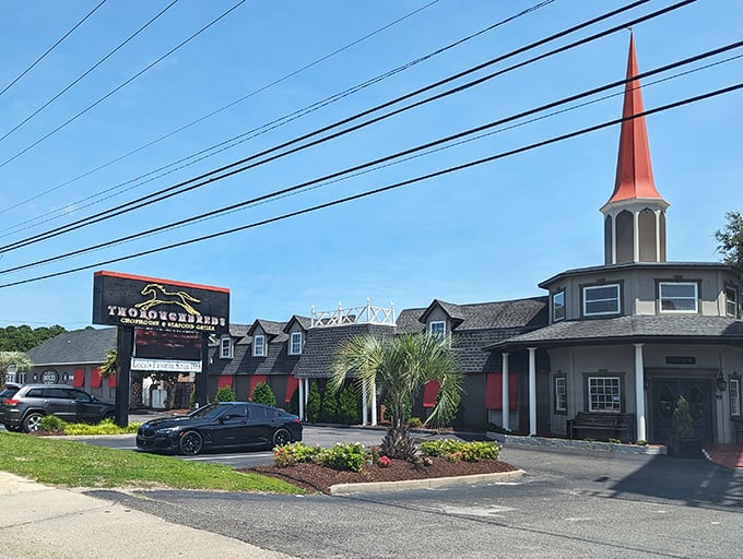 The distinctive red steeple and equestrian-themed sign announce Thoroughbreds like a beacon for hungry travelers. A true Myrtle Beach landmark that promises refined dining without pretension.