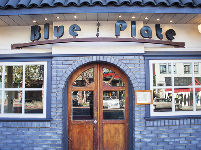 Blue Plate's charming exterior with its wooden parklet creates the perfect urban oasis for Mission District dining adventures.