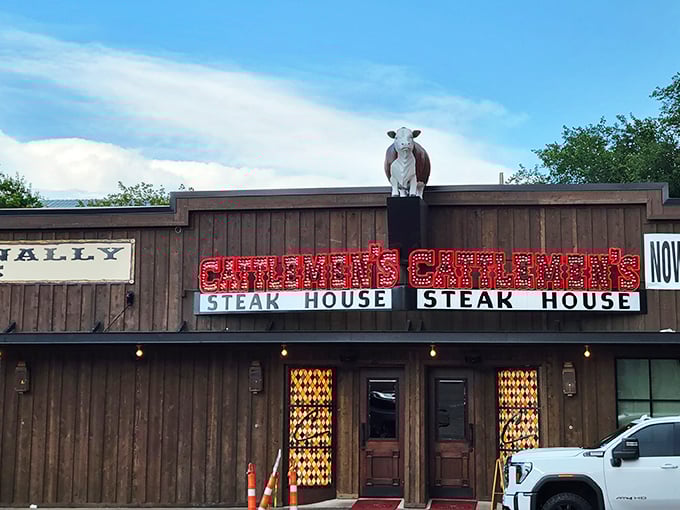 That neon glow against the Texas sky isn't just advertising—it's a promise of carnivorous delight waiting inside those wooden doors.