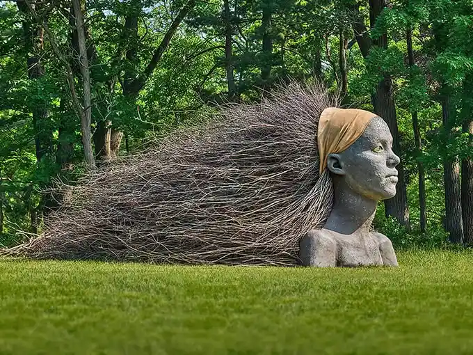 Like a modern-day Medusa who turned twigs instead of men to stone, this breathtaking sculpture captures nature's wild spirit flowing through human form.