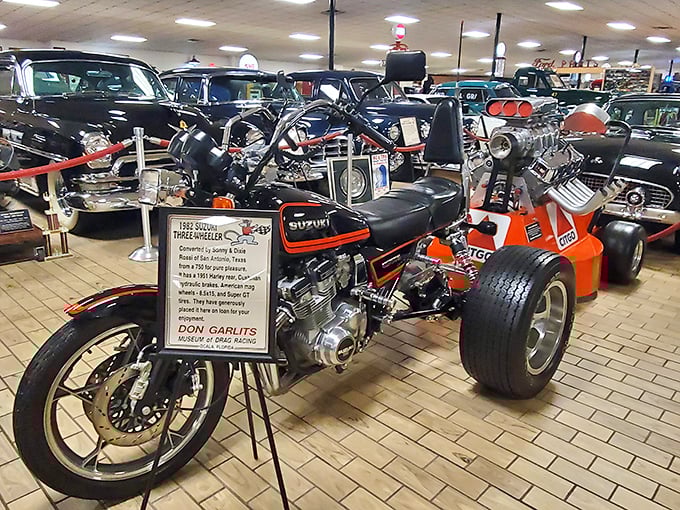 This modified Suzuki three-wheeler reminds us that speed demons come in all sizes. The orange accents practically dare you not to smile.
