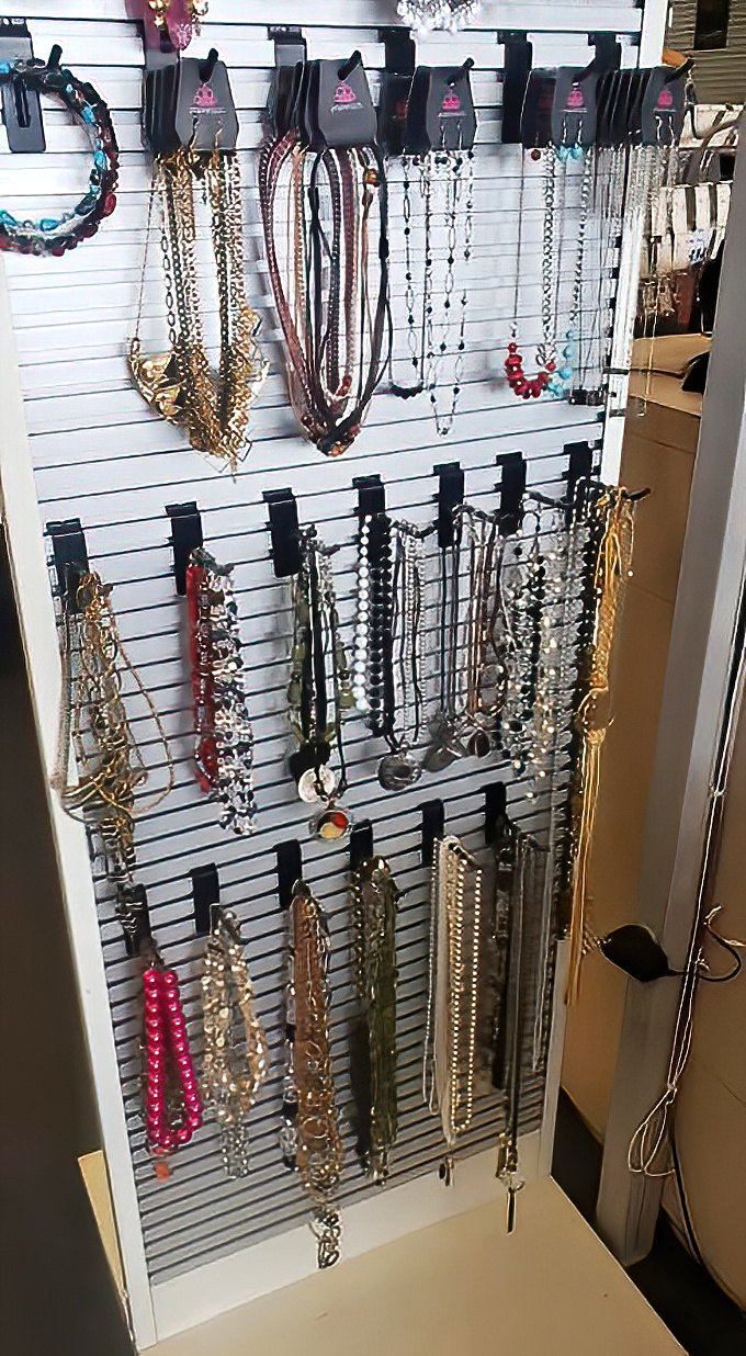 Jewelry and accessories displayed with gallery-like precision. These necklaces are ready for their second act—no drama, just glamour.