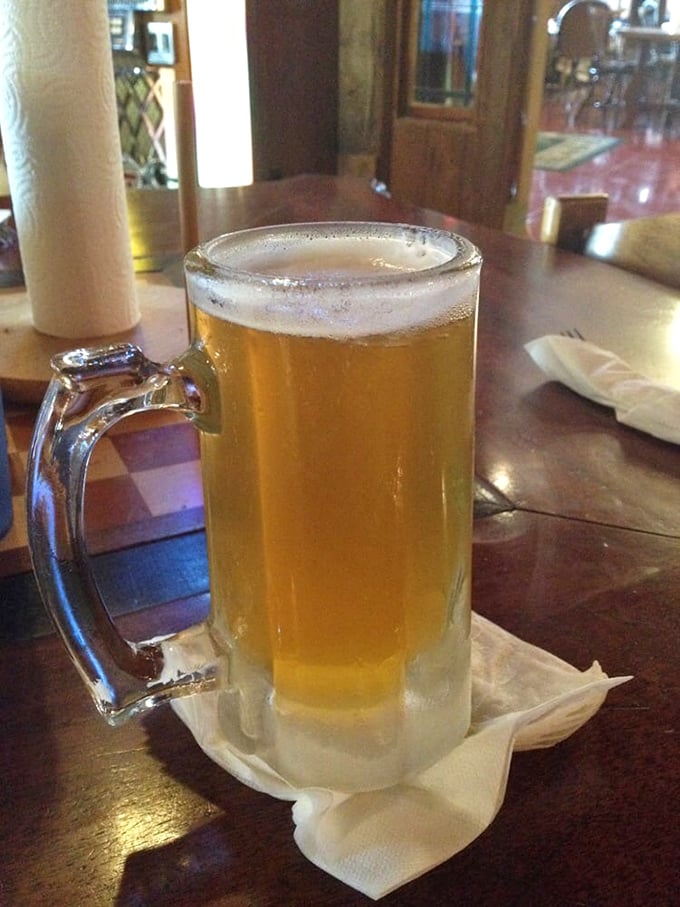 A frosty mug of golden ale that whispers, "Take your time, friend. The highway will still be there when we're done."