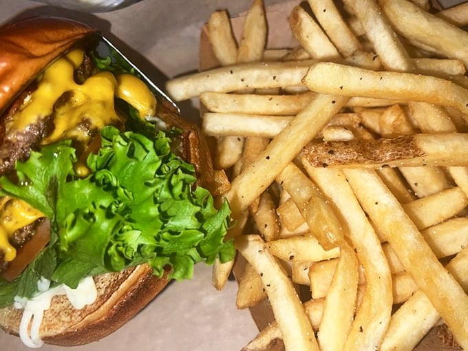 The classic American burger with fresh lettuce and cheese—proof that sometimes the traditional approach is still the most satisfying.