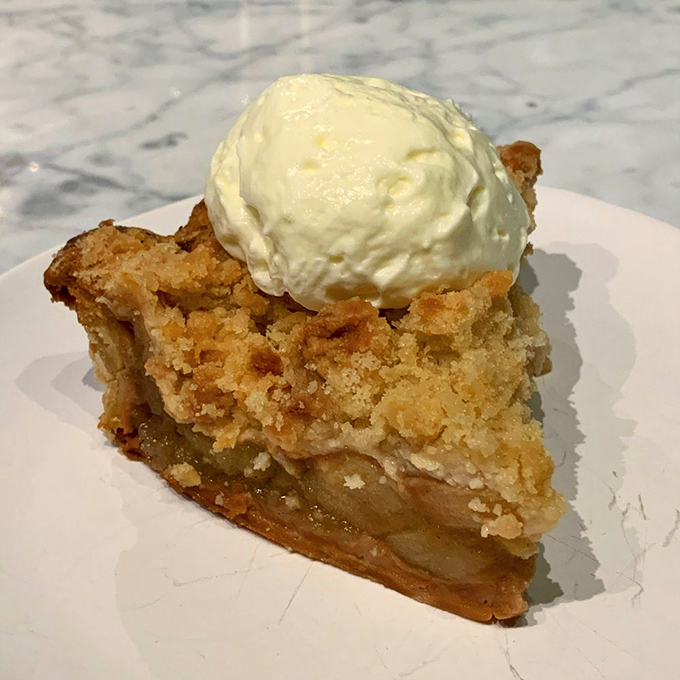 Apple crisp topped with vanilla ice cream: proof that dessert is not an option but a moral imperative. The warm-cold contrast is practically poetry.