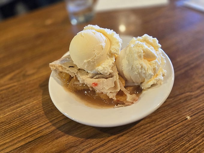 Apple pie à la mode—where warm, cinnamon-spiced fruit meets cold, creamy vanilla in a dance as old as American dining itself.