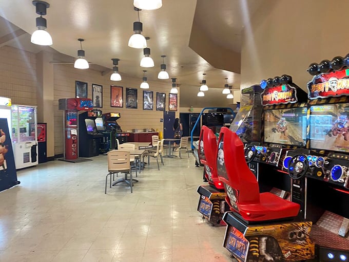 Between features, the arcade offers digital diversions with racing games and classic cabinets—intermission entertainment that rivals the main attraction.