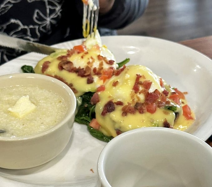 Eggs Benedict reimagined with avocado and bacon – proof that classics can evolve without losing their soul.