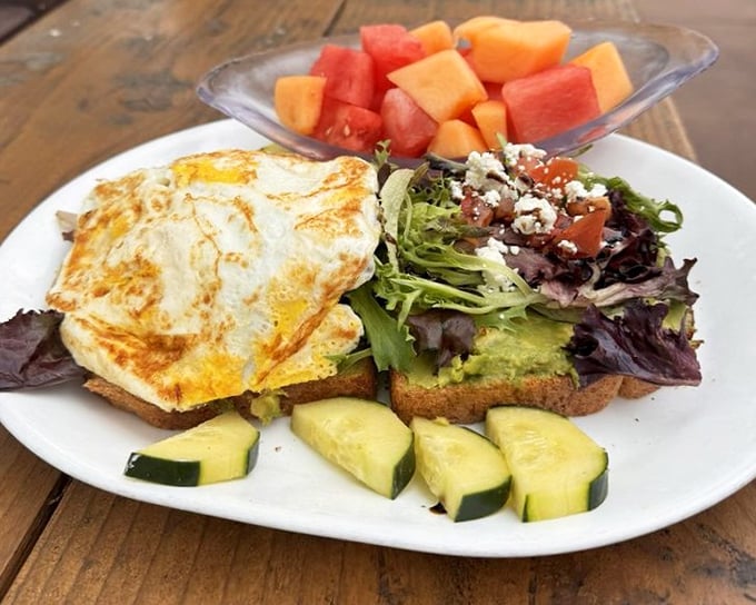 California meets comfort food – avocado toast gets the diner treatment with farm-fresh eggs and a side of fruit that makes you feel virtuous despite the indulgence.