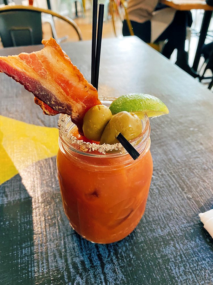 This Bloody Mary isn't just a drink—it's breakfast, lunch, and happy hour with a bacon exclamation point.