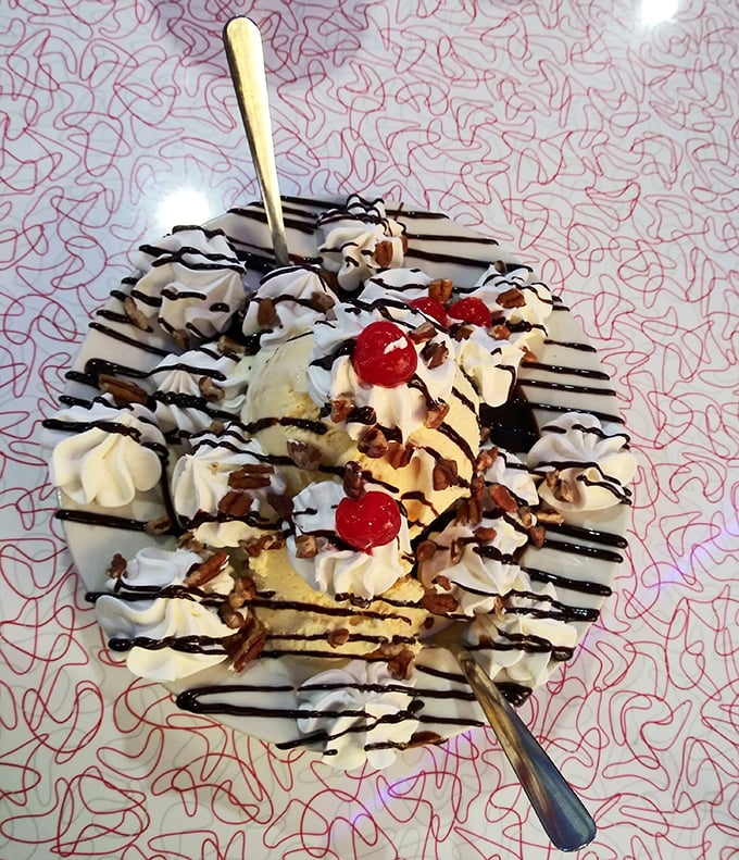 Banana splits at Starlite don't whisper—they shout with joy through mountains of whipped cream, chocolate drizzle, and cherries perched like tiny red berets.