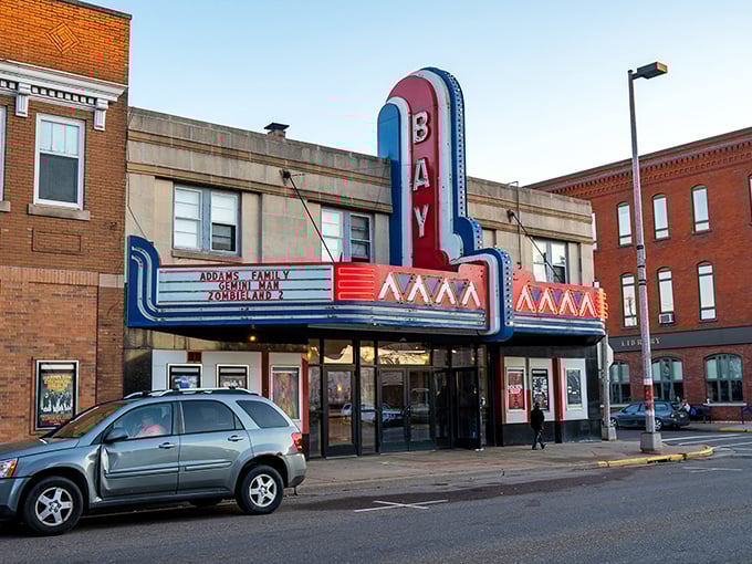 The Bay Theater's classic neon marquee promises entertainment the old-fashioned way—without subscription fees or buffering issues.