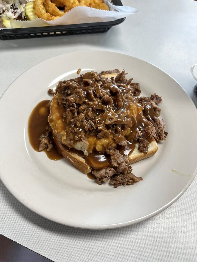 The legendary Beef Manhattan—open-faced, gravy-drenched comfort that makes you wonder why plates weren't designed square-shaped from the beginning.