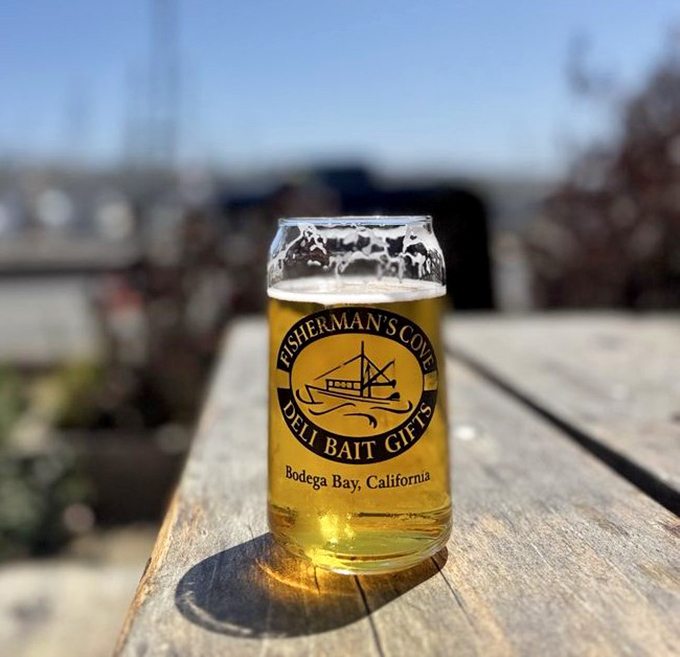 A cold beer in a Fisherman's Cove glass with that harbor view is what vacation memories are made of—liquid gold capturing California sunshine in every sip.
