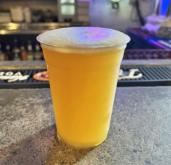 A golden glass of local brew, the perfect companion for barbecue—like finding the ideal dance partner for a slow Southern waltz.