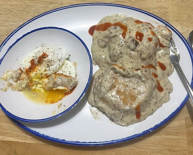Biscuits swimming in gravy with a side of perfectly fried eggs. Southern comfort that doesn't require a therapist's couch—just a good fork.