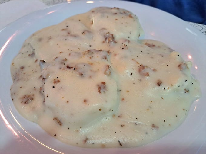 Biscuits and gravy that would make your Southern grandmother nod in approval – creamy, peppery, and unapologetically comforting.