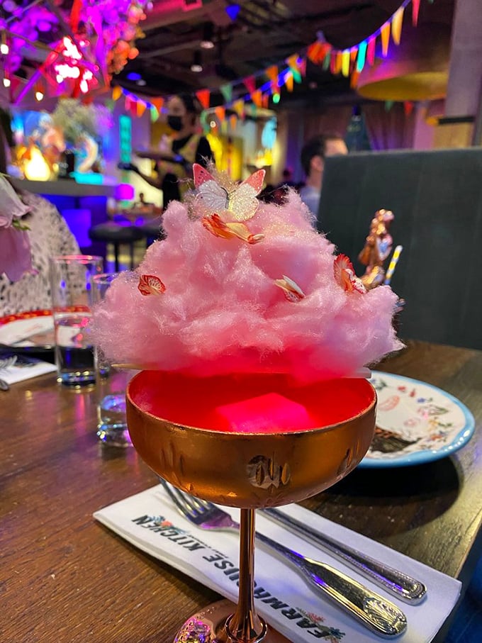 Not your average cocktail—this cotton candy concoction transforms from Instagram bait to serious libation when the liquid meets that fluffy pink cloud.