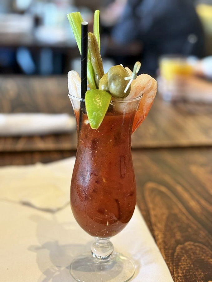 This Bloody Mary isn't just a drink—it's a meal with a cocktail permit. The celery stalk serves as both garnish and impromptu stirrer.
