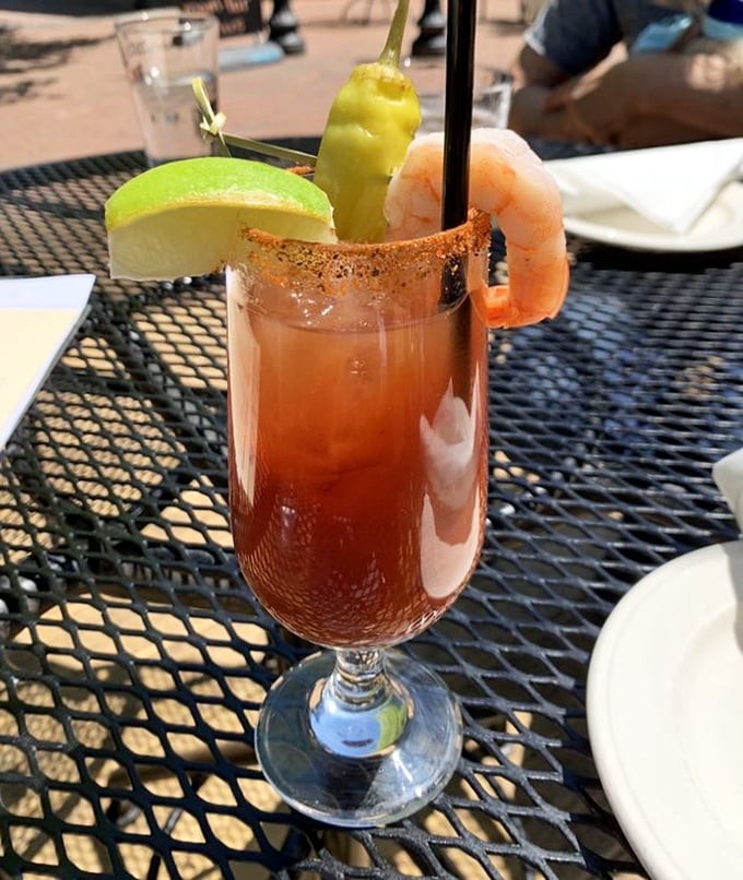 This isn't just a Bloody Mary—it's a meal in a glass, complete with a shrimp garnish that's practically waving hello as you take that first spicy sip.