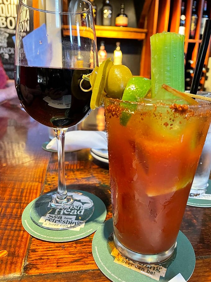 The perfect coastal pairing – a spicy Bloody Mary that doesn't skimp on garnish alongside a glass of rich red wine.