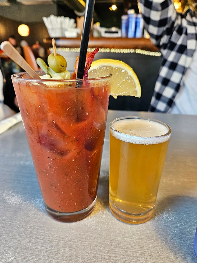 The Bloody Mary arrives with its own beer chaser—because in Wisconsin, one drink is merely a suggestion for another. Garnish game: expert level.