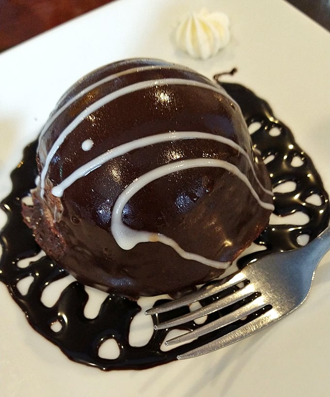 This chocolate dome isn't just dessert—it's edible architecture. The kind of sweet finale that makes you linger at the table long after the check arrives.
