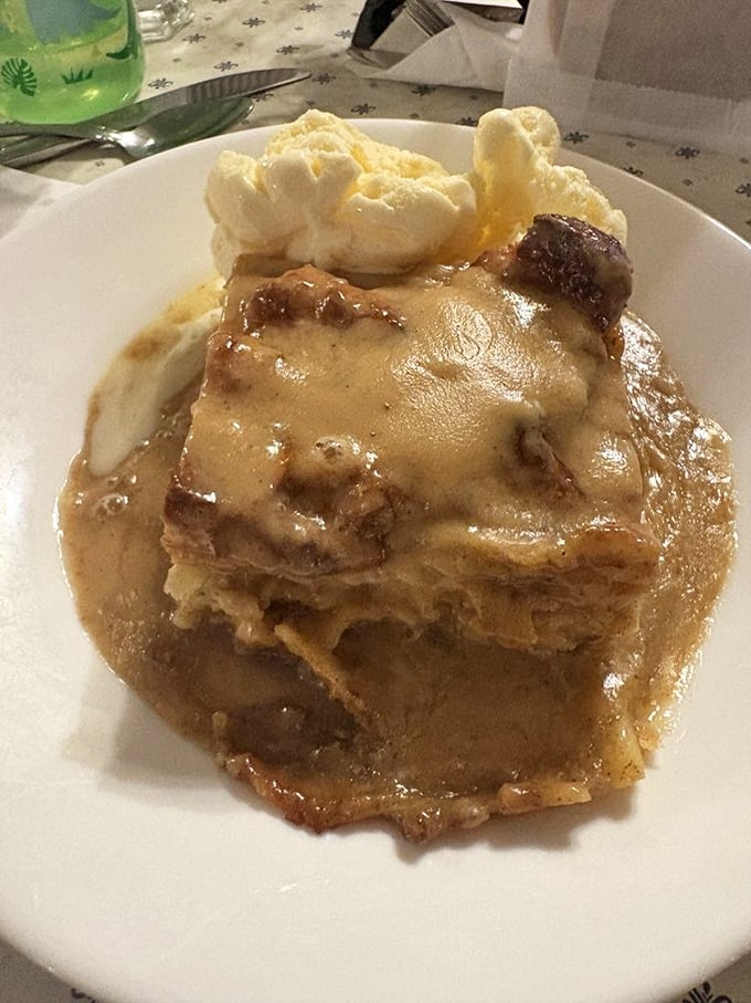 Bread pudding that doesn't whisper "dessert" but announces it with a megaphone, crowned with ice cream for good measure.