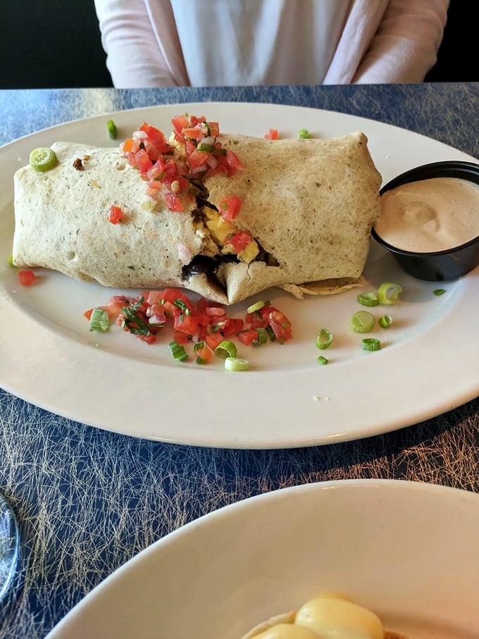 This breakfast burrito doesn't just start your day—it launches it into orbit with fresh ingredients and flavors that make alarm clocks worth tolerating.