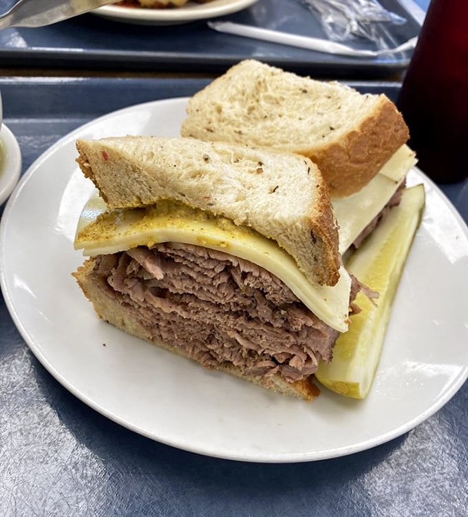 Brisket on rye that doesn't need fancy garnishes to impress—just honest-to-goodness meat stacked high enough to make your jaw unhinge in anticipation.