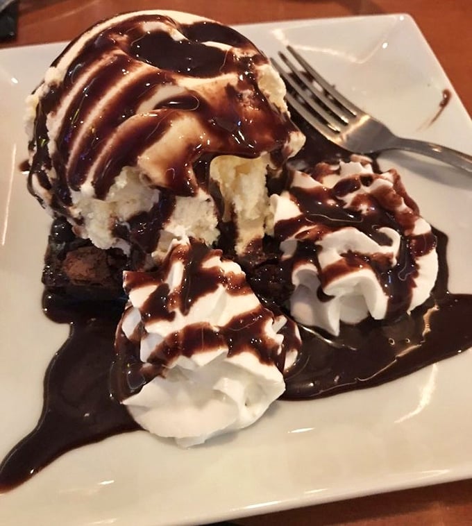 A brownie sundae that doesn't just satisfy your sweet tooth – it throws a party for it, complete with chocolate drizzle confetti.
