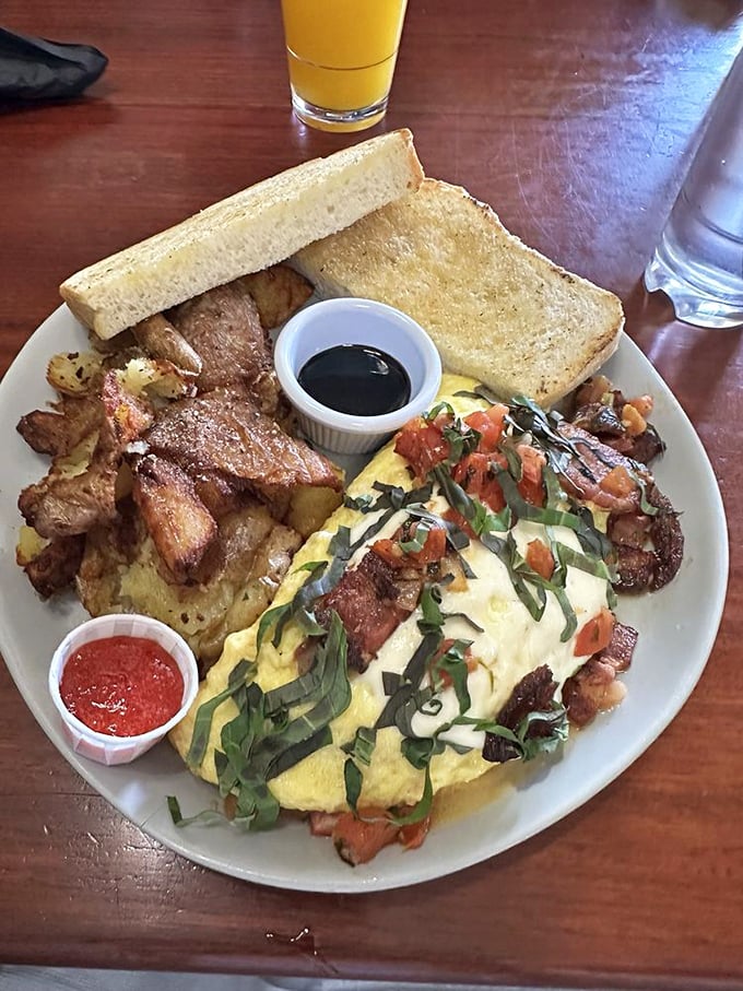 Not all heroes wear capes—some wear fresh herbs and tomatoes. This omelet brings garden-fresh flavor to the breakfast table with artistic flair.