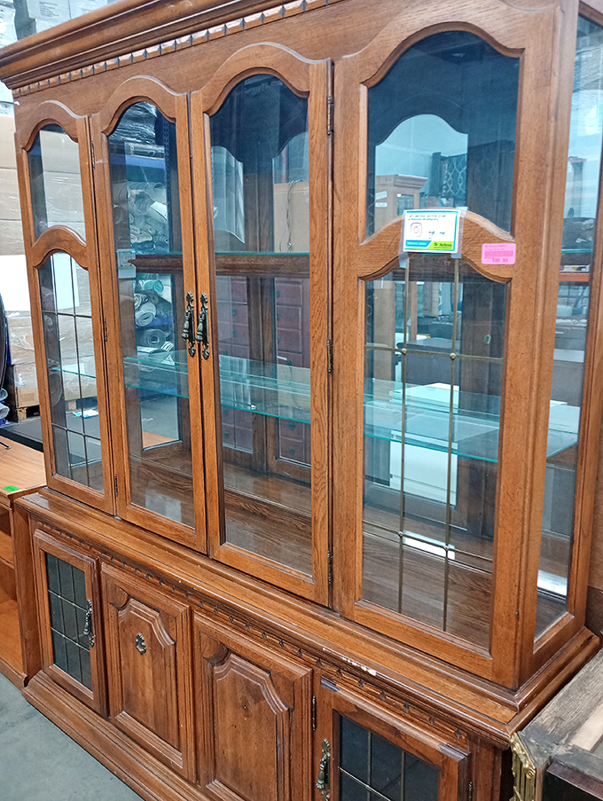 This isn't just a china cabinet—it's a time machine to Sunday dinners at Grandma's, complete with crystal and conversation.